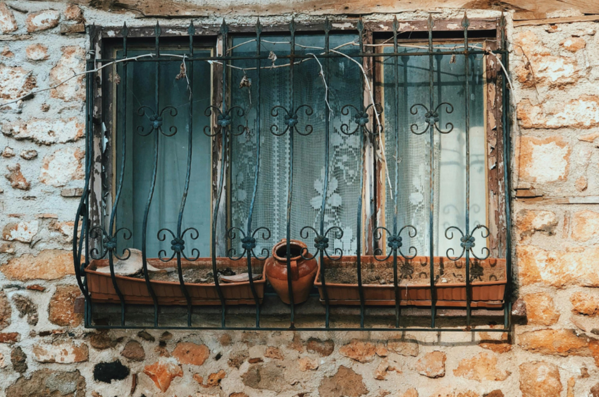 Here's Why Some Window Bars Curve At The Bottom - Opposing Views